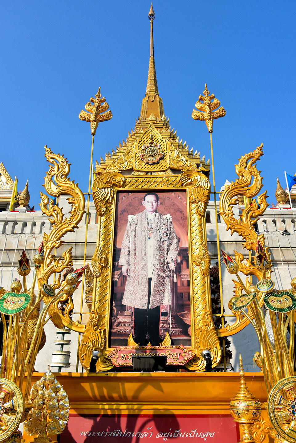 King Rama IX Portrait at Wat Traimit in Bangkok, Thailand - Encircle Photos